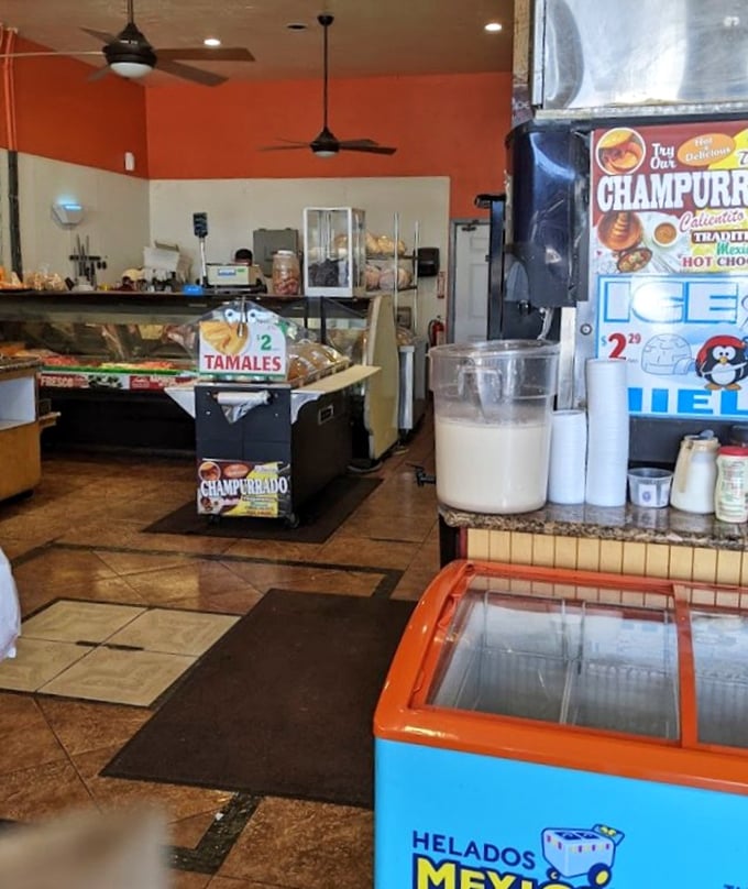 Champurrado signs and ice cream freezers create the perfect backdrop for this neighborhood gathering spot.