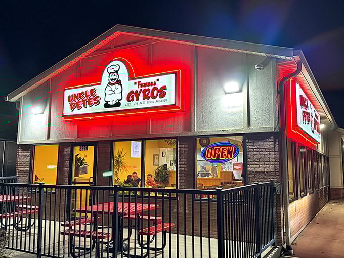 As night falls, the illuminated sign glows like a lighthouse guiding hungry travelers to Mediterranean shores. Some food just tastes better after dark.