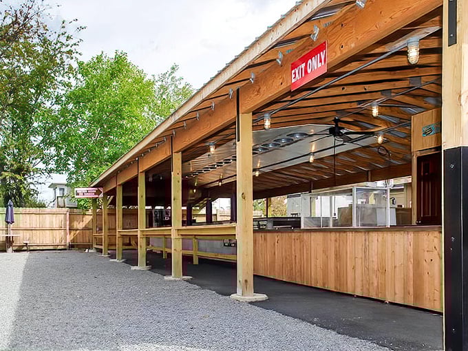 The covered outdoor area isn't just practical&mdash;it's where summer memories are made between bites of perfectly smoked meats.