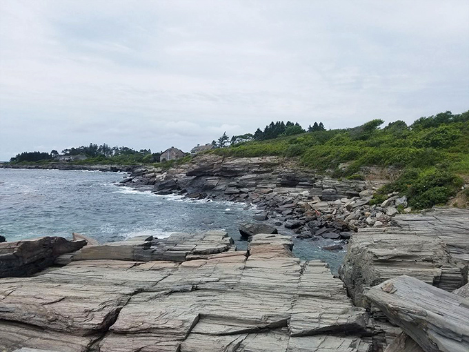 Layers of earth meeting endless ocean. These ancient stone shelves tell geological stories older than human history, one wave at a time.