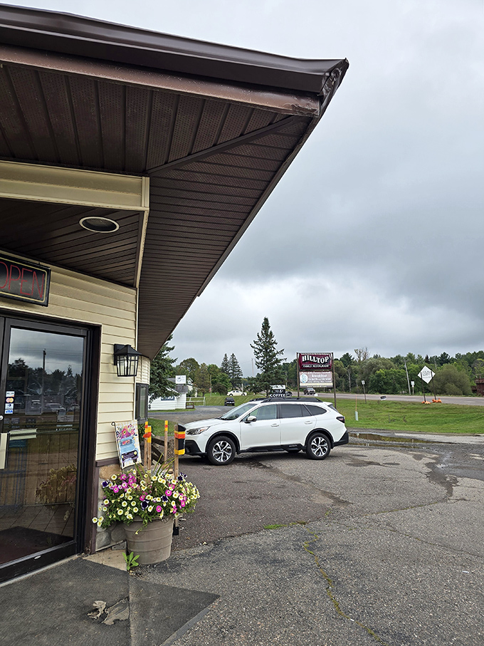 Even on a cloudy Michigan day, Hilltop's cheerful exterior and flower pots promise warmth and comfort just beyond those doors.