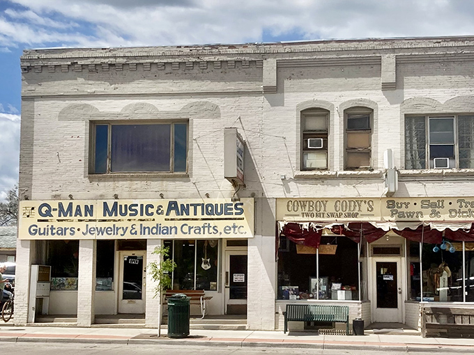 Q-Man Music & Antiques and Cowboy Cody's share a wall and a philosophy: the best treasures aren't mass-produced, they're discovered.