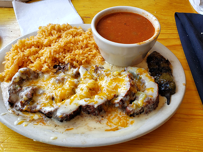 The Ribeye Rellenos combine the best of Texas and Mexico&mdash;tender beef smothered in cheese alongside Spanish rice and beans.
