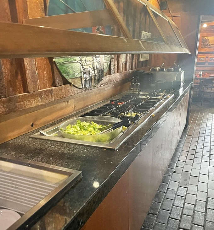 The salad bar: where good intentions meet temptation in a battle that always ends with "just a little more won't hurt."