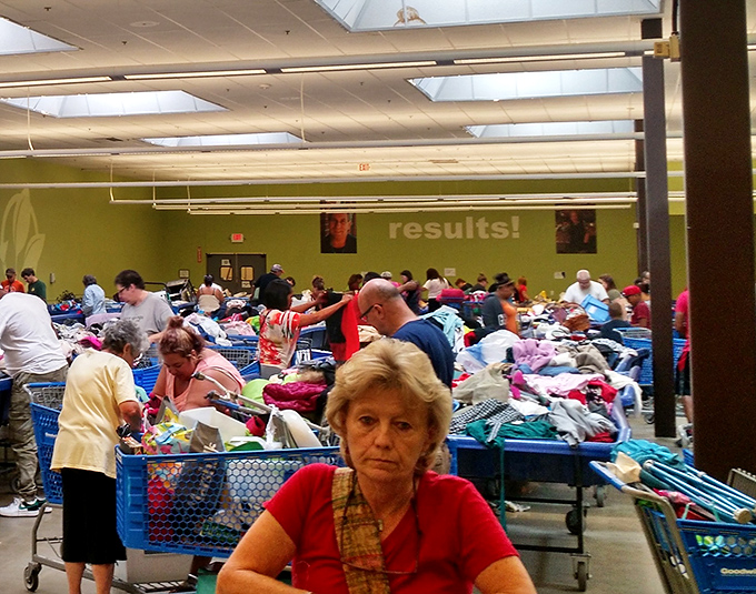 The Buy by the Pound section: where seasoned thrifters demonstrate Olympic-level shopping skills. Note the focused determination on every face.