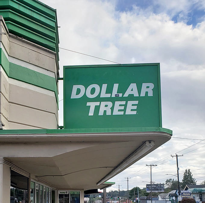 The Dollar Tree sign stands proud against the Washington sky, a beacon of hope for the financially savvy and impulse shoppers alike.