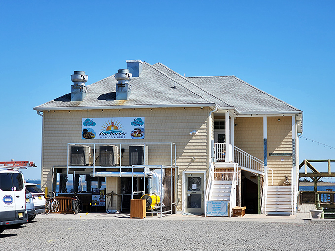 Sun Harbor's weathered shingle siding tells tales of countless summers, where seafood tastes better with salt air and bay views.
