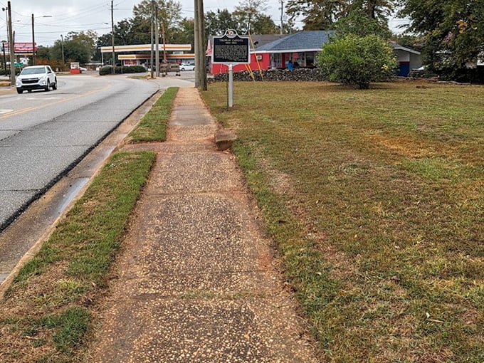 Weathered sidewalks have carried generations of footsteps, including those of literary giants whose childhood wanderings shaped American classics.
