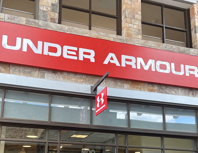 Under Armour's bold red signage stands out like a beacon for athletes and people who just want to look athletic while grocery shopping.