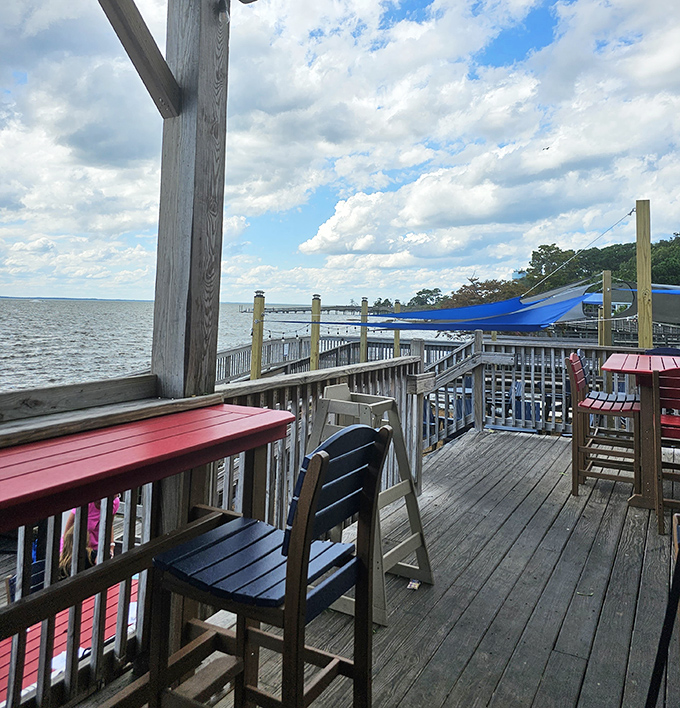 Waterfront deck seating where the boundary between restaurant and nature blurs&mdash;dining with a soundtrack of gentle waves and seabird solos.