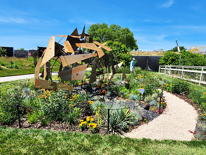 Modern sculpture meets traditional gardening in this artistic installation. Nature and human creativity having a conversation that everyone's invited to overhear.