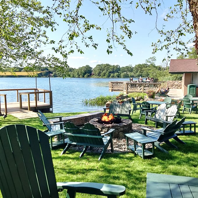 The lakeside fire pit area &ndash; where summer evenings stretch into night and nobody checks their watch because time doesn't matter when you're this comfortable.