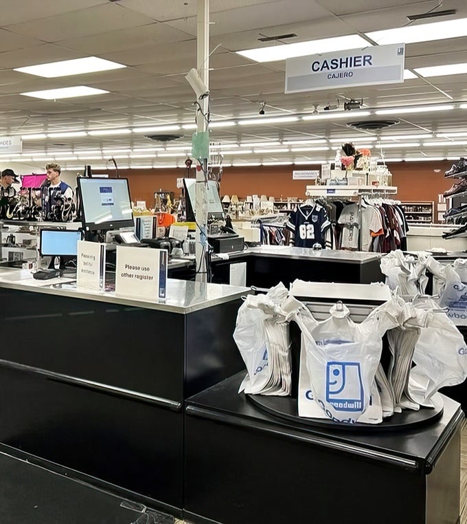 The final stop on your thrifting adventure: a cashier ready to ring up your treasures. The moment of truth when you realize how much you saved.