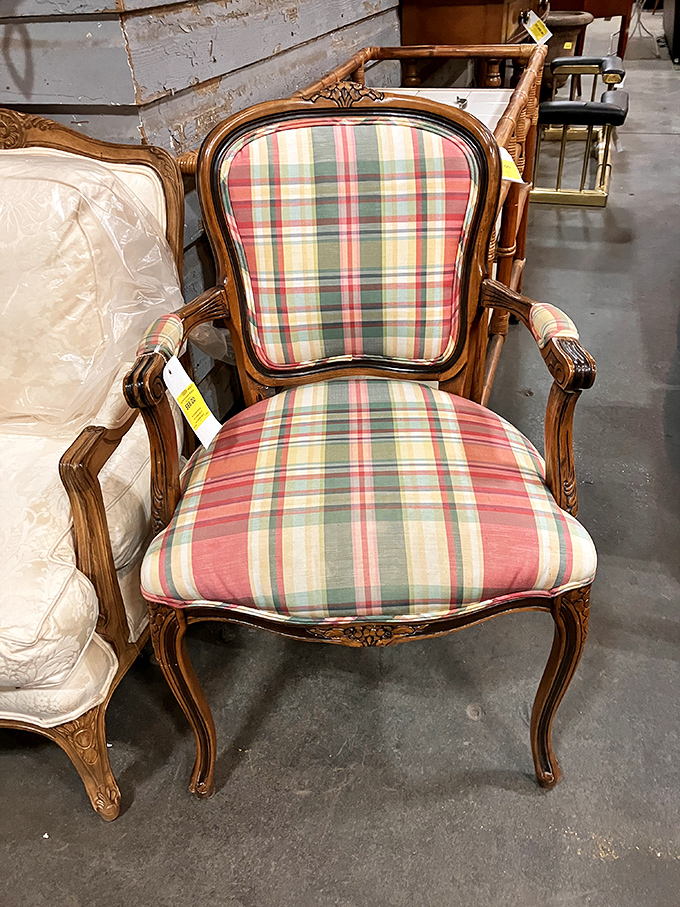 This plaid-upholstered chair has seen some living rooms in its day. With carved wooden details and timeless lines, it's ready for its next chapter.