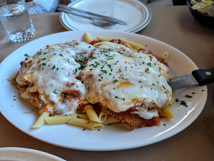 Chicken parmesan that puts your grandmother's recipe in serious jeopardy. That cheese pull should be classified as performance art.
