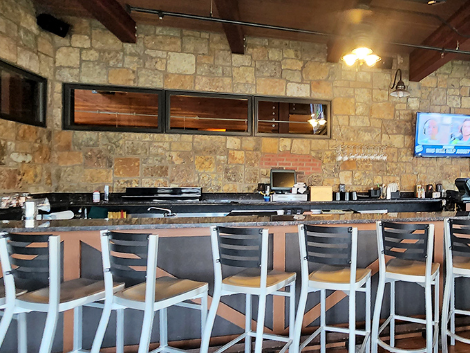 Counter seating with a view of the action, where stone meets modern in a perfect balance of rustic and refined.