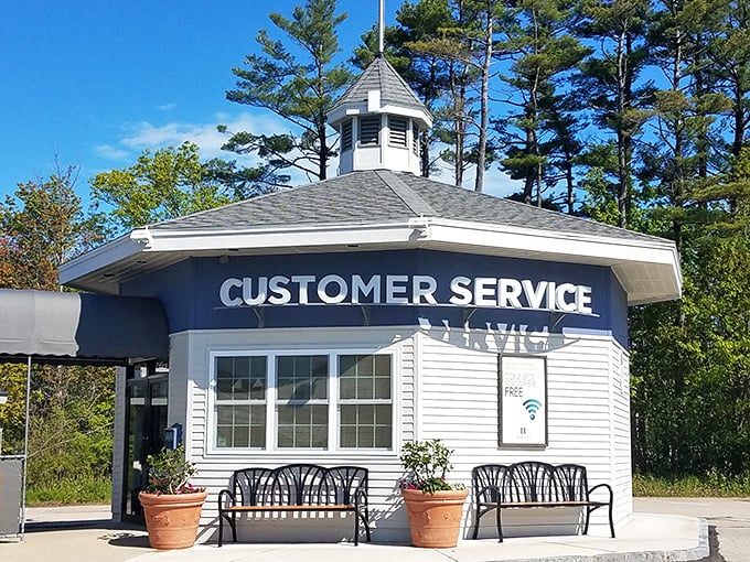 The charming Customer Service gazebo stands ready to assist &ndash; like a retail concierge desk with New England architectural flair.