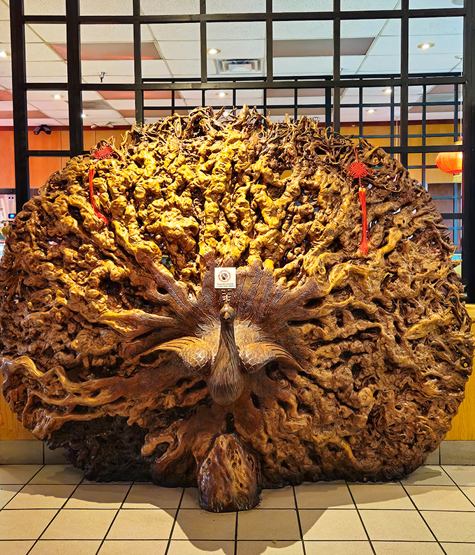 This impressive wood carving stands as the restaurant's unofficial greeter, a conversation piece that's witnessed countless food comas.