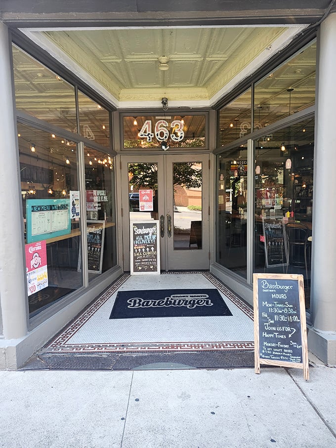 The entrance vestibule at Bareburger feels like crossing a threshold into burger paradise. The illuminated "463" sign ensures you've found your destination.