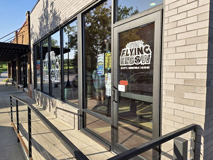 The entrance beckons like the gateway to flavor paradise. That logo promises a body slam of taste you won't soon forget.