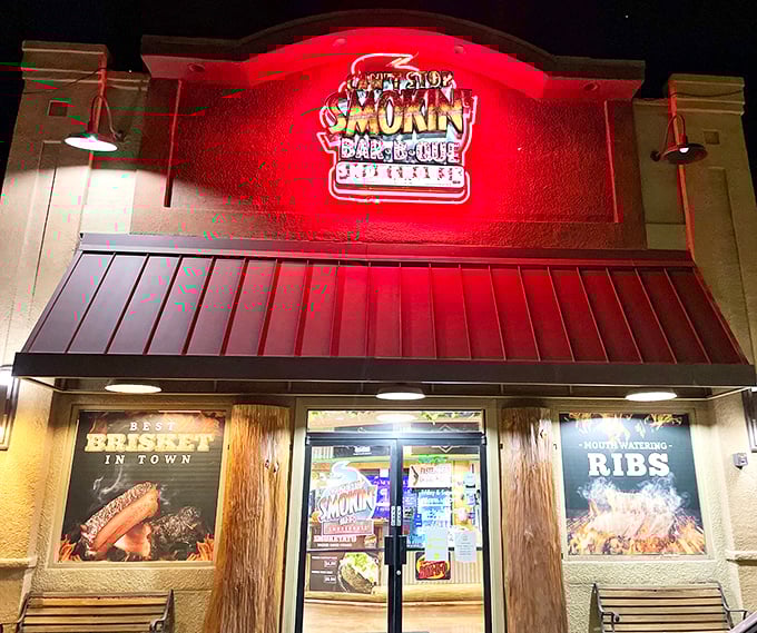 Night transforms the entrance into a beacon of barbecue hope. Like a Vegas sign, but the only gambling here is on how many napkins you'll need.