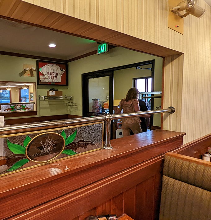 Stained glass accents and local sports memorabilia—subtle reminders you're in a place that celebrates both craftsmanship and community pride.