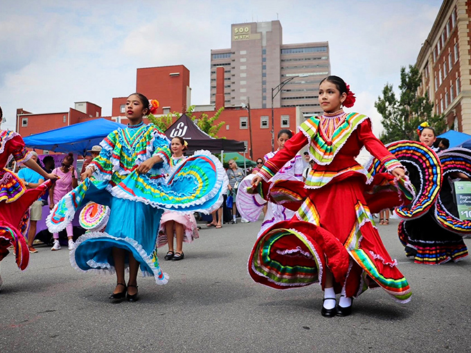 Vibrant traditional dancers bring cultural celebrations to life, showcasing Winston-Salem's diverse community spirit through movement, music, and magnificent costumes.