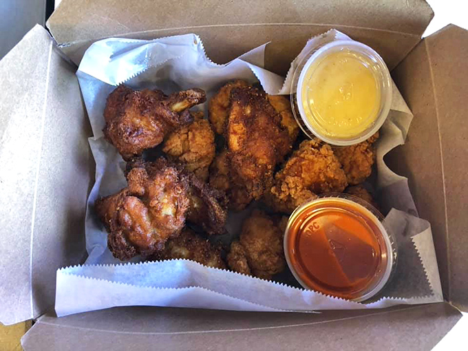 Fried chicken that makes you question every other version you've ever had. Those dipping sauces aren't accessories&mdash;they're supporting actors in a delicious drama.