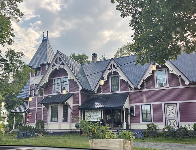As dusk approaches, the mansion's silhouette becomes even more magical, like a Victorian postcard come to life in rural Maine.