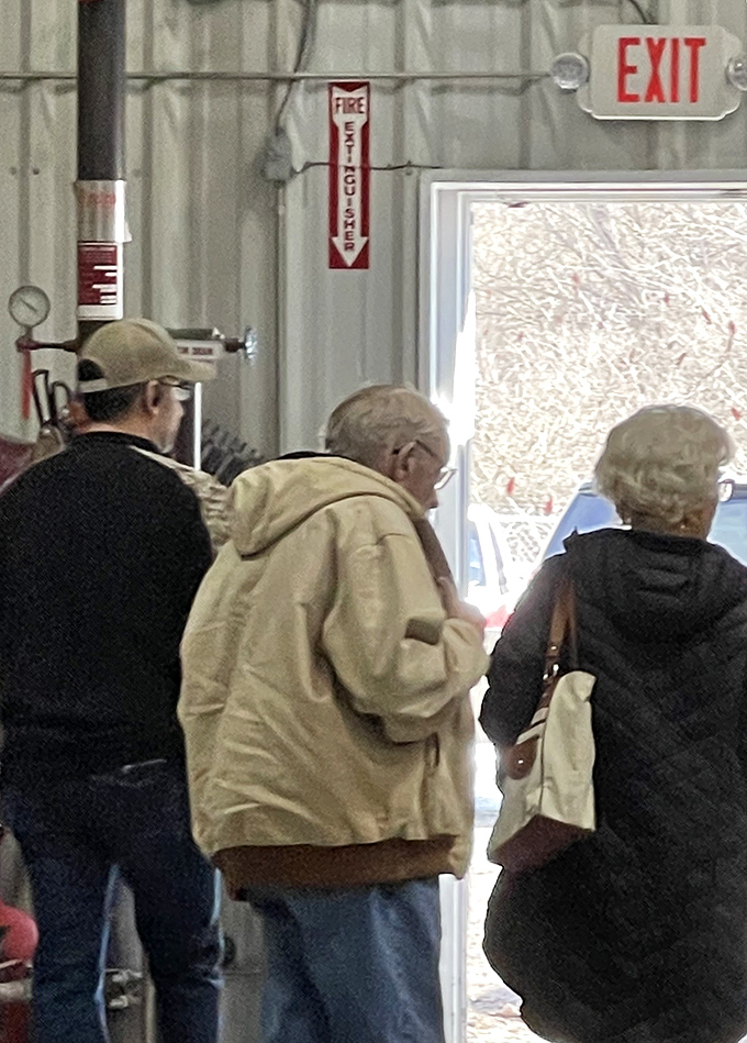 The exit strategy: shoppers departing with treasures in hand, already planning their return for the next great bin adventure.