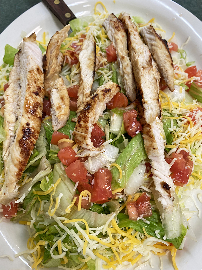 A grilled chicken salad that doesn't feel like punishment – fresh, colorful, and substantial enough to satisfy even dedicated carnivores.