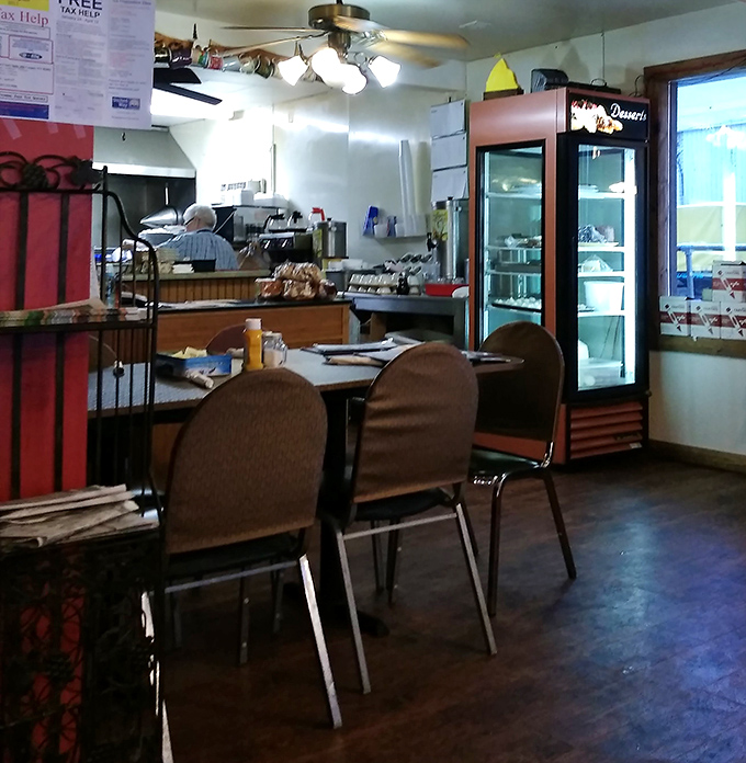 The dessert case stands guard near simple tables&mdash;a sweet sentinel reminding you to save room for pie.