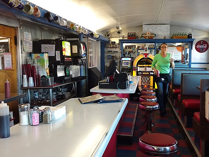 The classic railcar layout creates the perfect diner physics: narrow enough for community, spacious enough for private conversation over coffee.