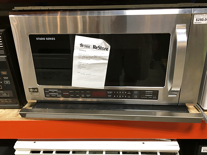 Stainless steel LG microwave looking so pristine you'd never guess it had a previous life. Leftovers never had it so good.