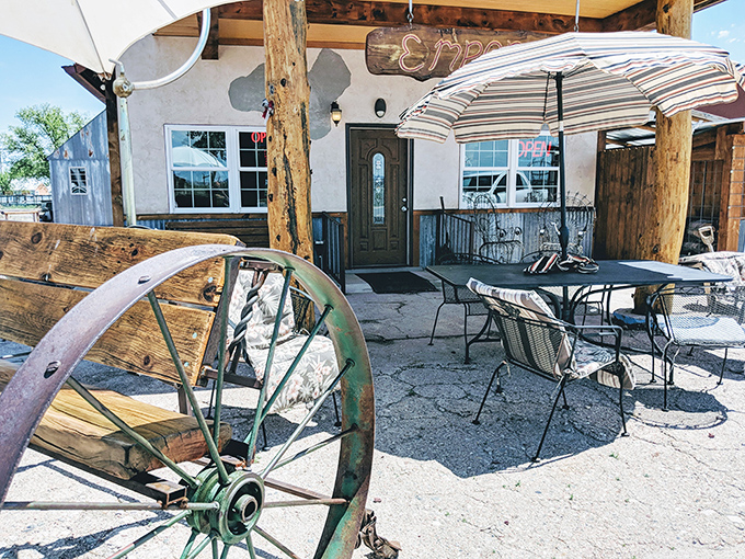 The outdoor seating area where Wyoming's endless blue sky becomes part of the ambiance. That wagon wheel has seen things it can't unsee.
