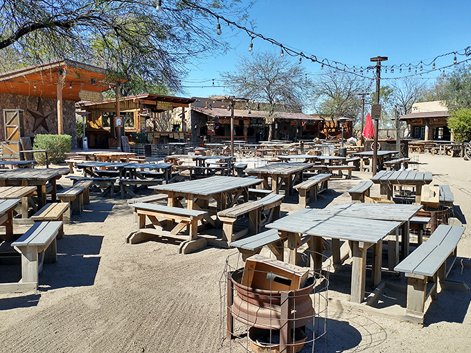 Picnic tables under desert skies where memories are made between bites. Arizona dining that understands sometimes the best ceiling is no ceiling at all.