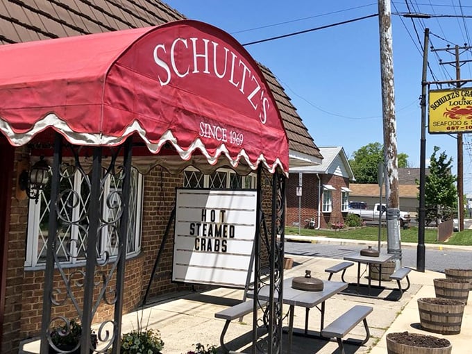 The outdoor picnic tables aren't just seating&mdash;they're front-row tickets to the "Hot Steamed Crabs" show, running daily since 1969.