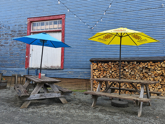 Picnic tables and stacked firewood&mdash;a reminder that the best dining experiences often come with a side of Vermont's natural beauty.