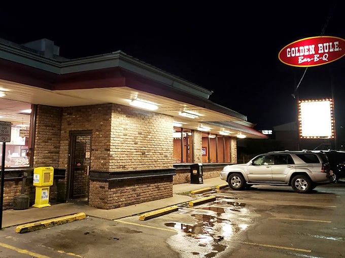Even at night, that illuminated sign stands proud, a lighthouse for the barbecue-seeking souls navigating Alabama's culinary waters.