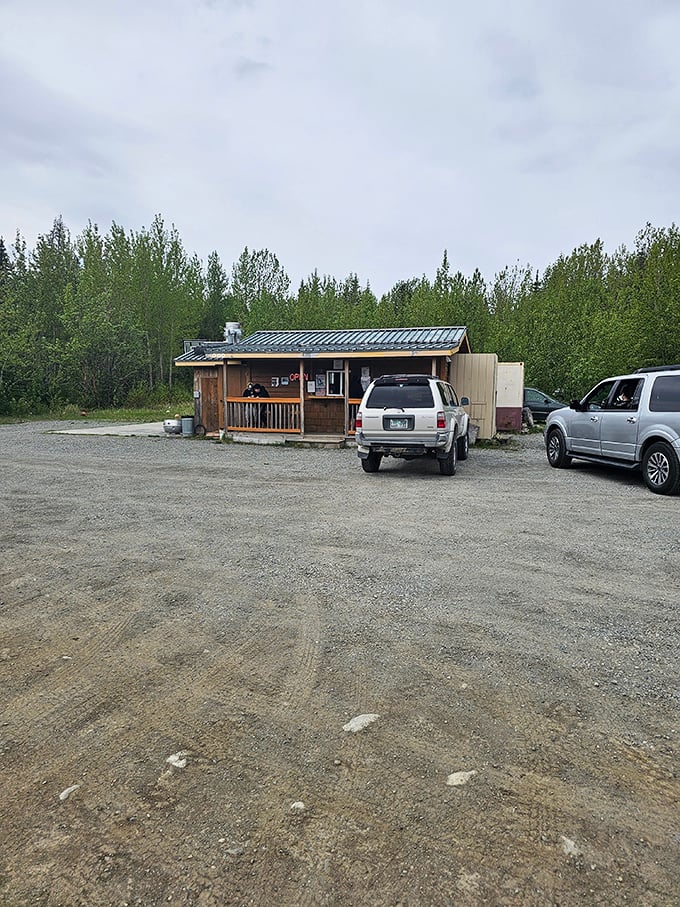 Where burger pilgrims park their chariots. This gravel lot might not look like much, but it's the gateway to flavor paradise.
