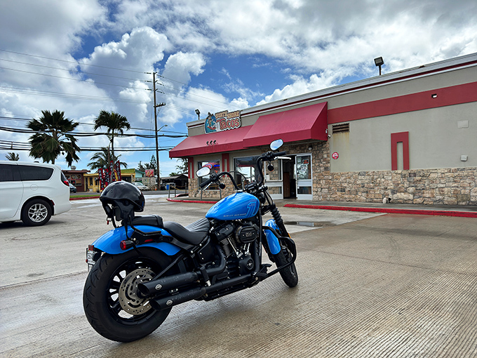 Even motorcycles need lunch breaks, and this blue beauty knows exactly where to park for premium fuel of the human variety.