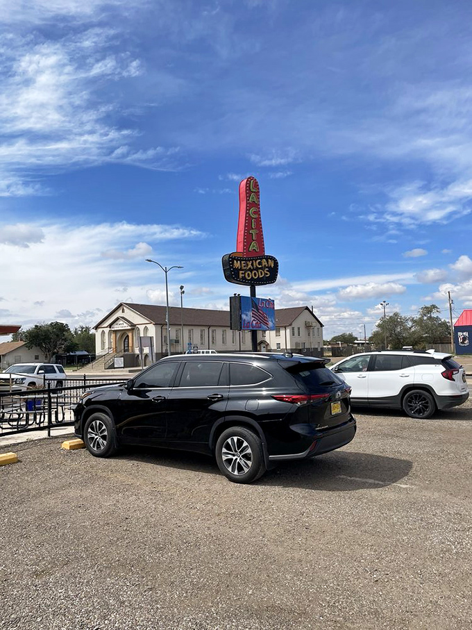 The parking lot view that signals your taste buds are about to have their best day. That sign promises, and the kitchen delivers.