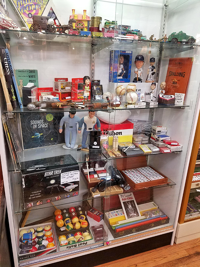 Star Trek memorabilia neighbors vintage pool balls in this cabinet of curiosities &ndash; proof that nerd culture wasn't invented yesterday, it was just better packaged.