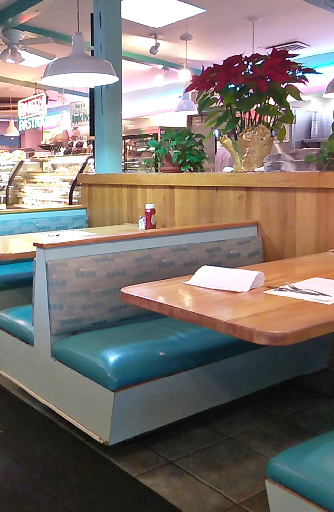 Turquoise booths invite you to slide in and stay awhile&mdash;possibly until your next meal, which could be in about 20 minutes.