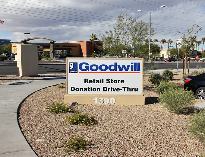 Desert landscaping frames the unmistakable signage. This donation drive-thru makes decluttering as easy as a fast-food run.