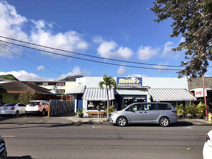 Morning pilgrims make their way to this unassuming temple of breakfast, where parking spots are as coveted as the last bite of lilikoi pancake.