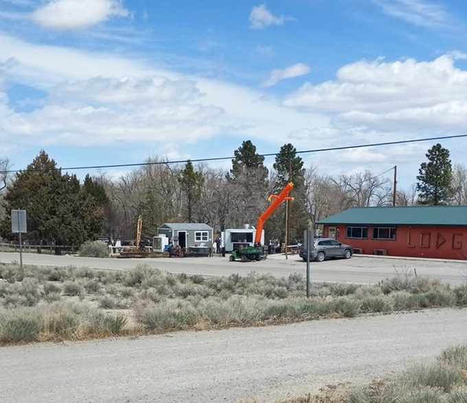 A beacon of hope on the high desert plain. That orange flag isn't just advertising food&mdash;it's signaling salvation for hungry travelers.
