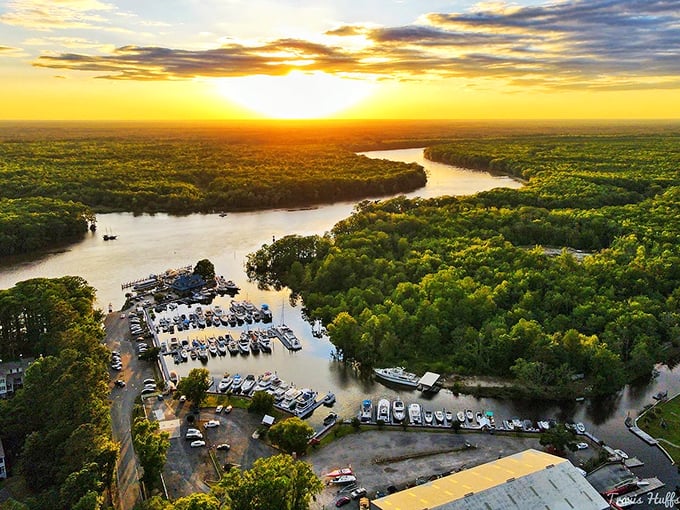 Golden light bathes the winding inlet as day surrenders to night in this spectacular aerial perspective.