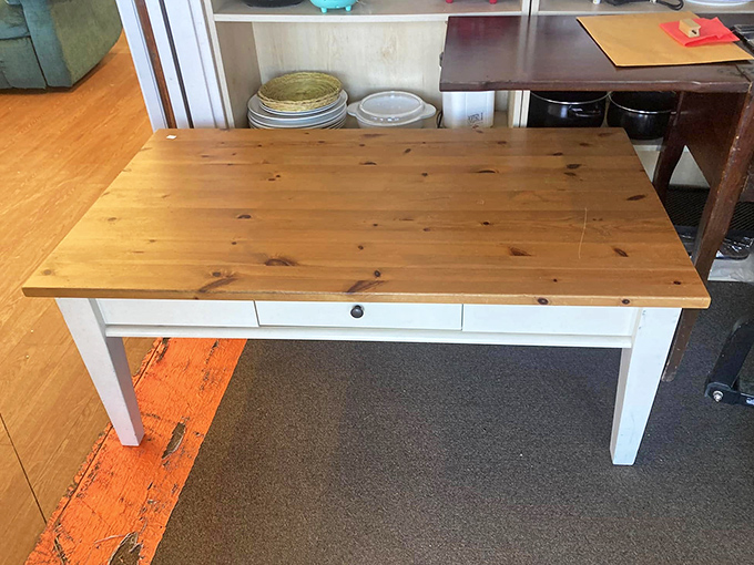 This farmhouse-style table with its pine top and white base is just waiting to host family gatherings and homework sessions in its next home.