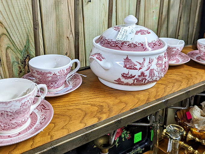 Delicate teacups that once hosted proper afternoon conversations now wait patiently for their next pour—perhaps at your table?